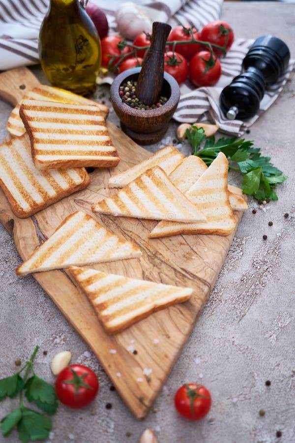Toasted Bread Slices on Wooden Cutting Board for Breakfast Stock Image ...