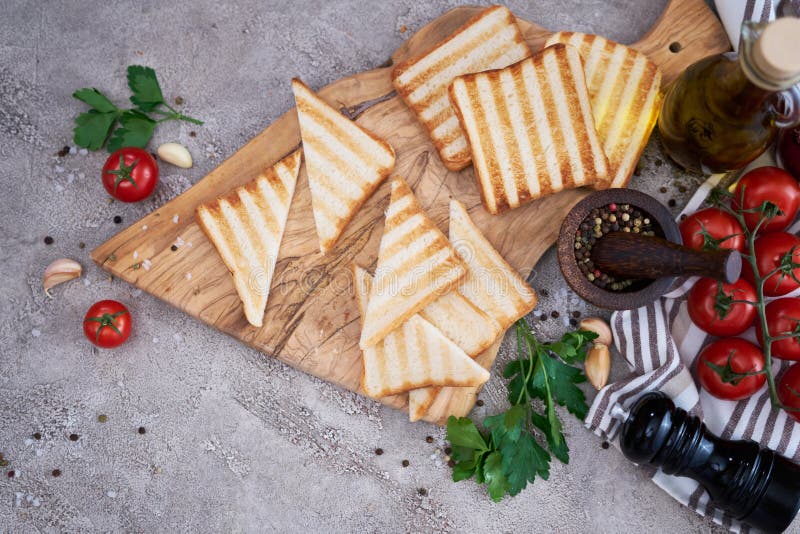 Toasted Bread Slices on Wooden Cutting Board for Breakfast Stock Image ...