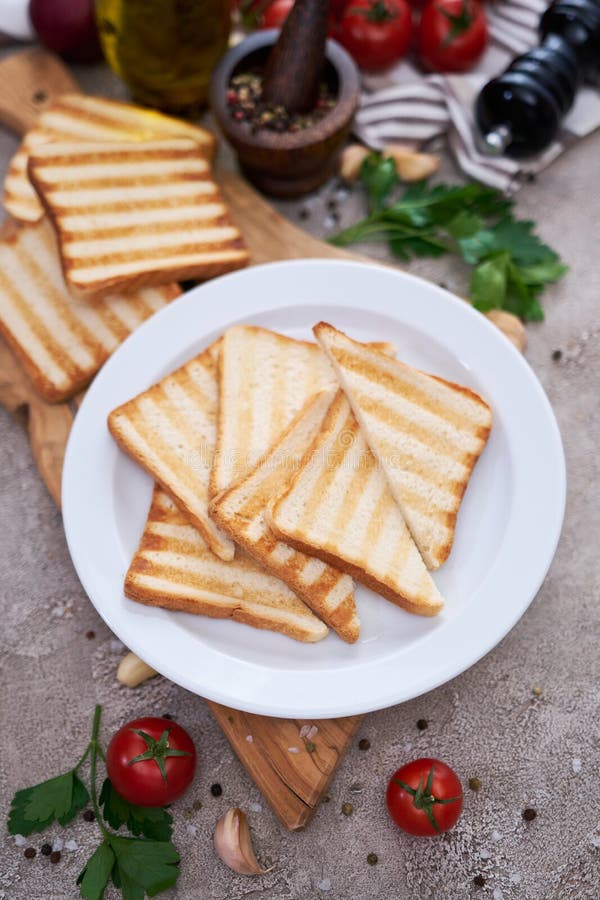 Toasted Bread Slices on Wooden Cutting Board for Breakfast Stock Image ...