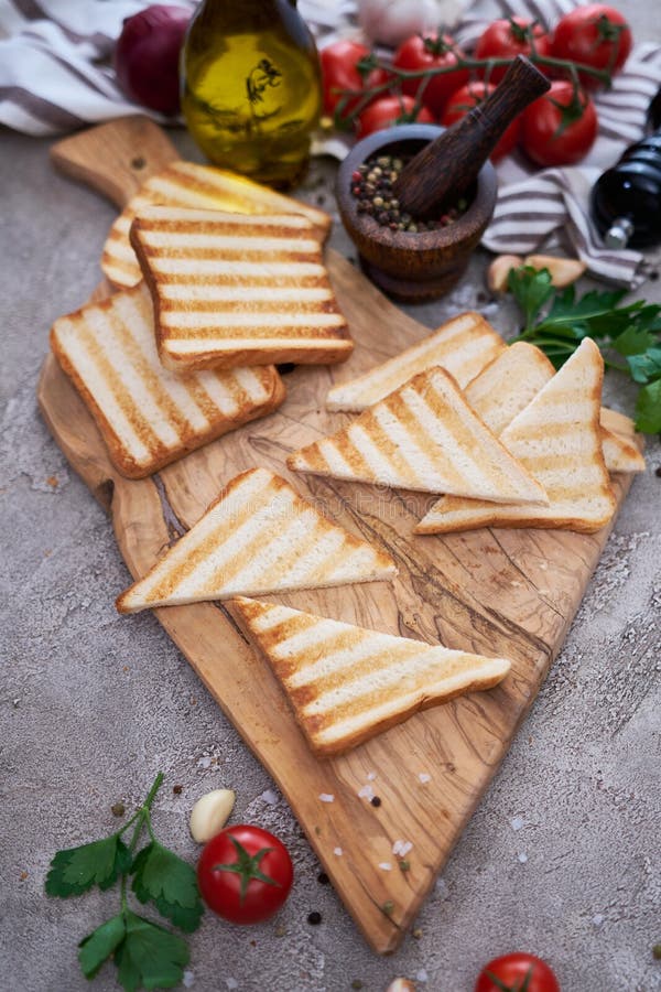 Toasted Bread Slices on Wooden Cutting Board for Breakfast Stock Photo ...