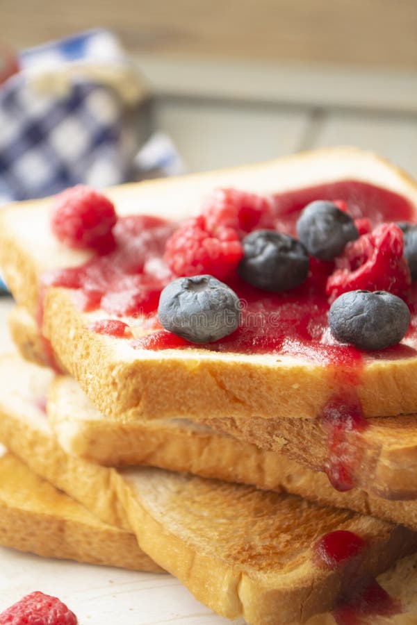 Toasted Bread with Sweet Raspberry and Blueberry Jam for Breakfast ...