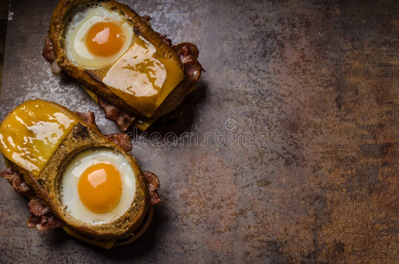 Toasted cheese bread with egg inside. Cheddar, lunch. - Stock Image ...