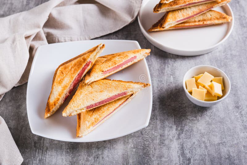 Toasted Ham and Cheese Toasts on a Plate on the Table Stock Photo ...