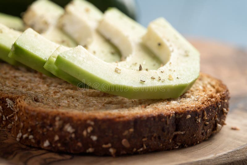 Toasted Rye Bread with Sliced Avocado and Herbs Stock Image - Image of ...