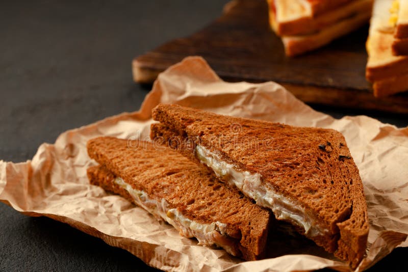 Toasted Rye Sandwich with Ham Cut into Halves on Table Stock Photo ...