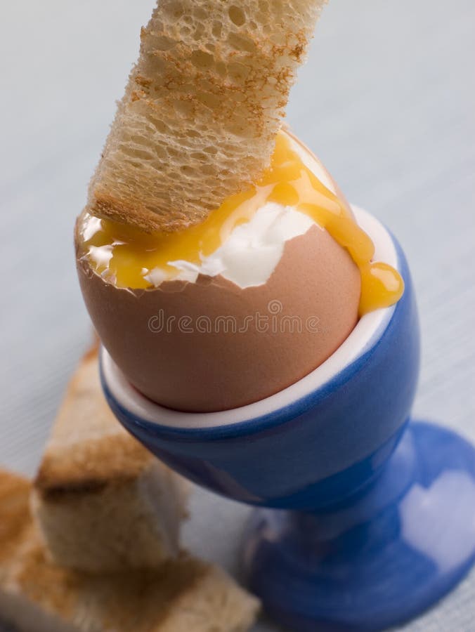 Toasted Soldier Being Dipped into a Runny Yolk Stock Image - Image of ...