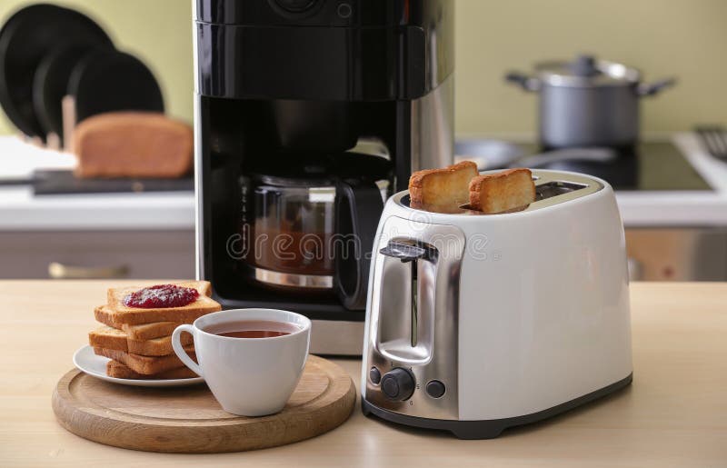 Toaster with Bread Slices and Coffee Machine on Table Stock Image ...