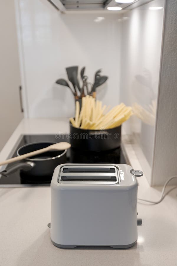 Toaster Detail in a Modern White Kitchen with the Pot Behind it with ...