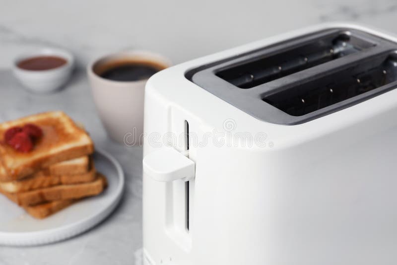 Toaster and Roasted Bread on Table, Closeup Stock Photo - Image of ...