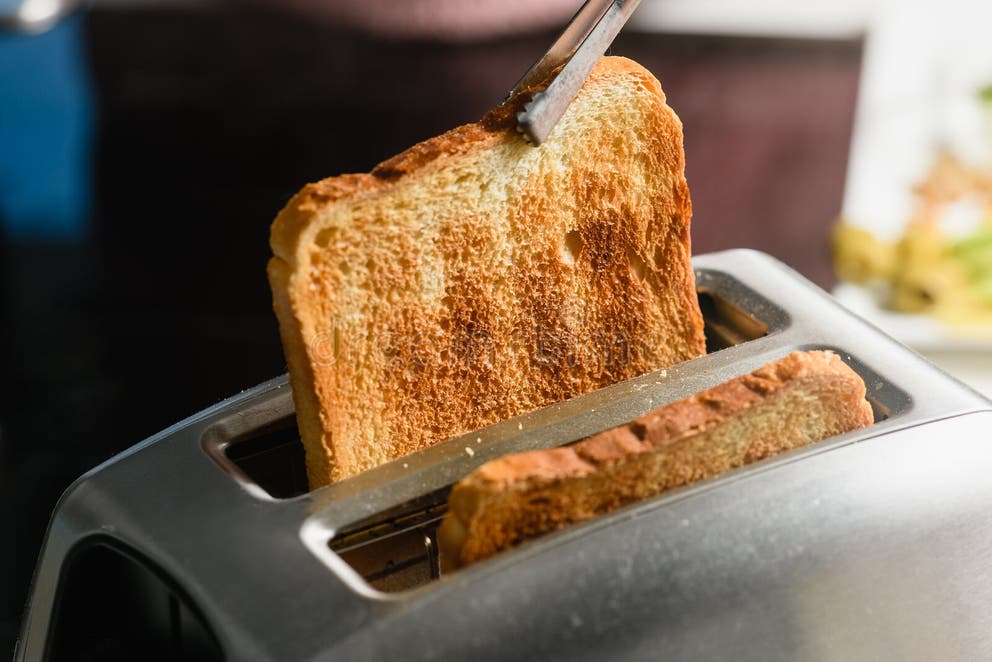Toaster with Toasted Bread for Breakfast Inside Stock Image - Image of ...