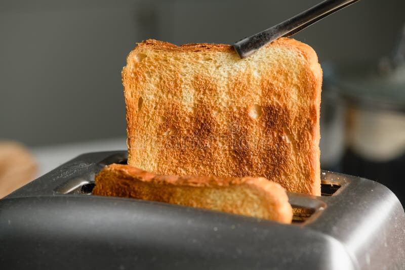 Toaster with Toasted Bread for Breakfast Inside Stock Photo - Image of ...