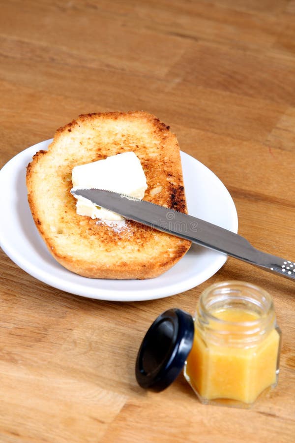 Toasts with Butter and Orange Jam Stock Photo - Image of morning ...