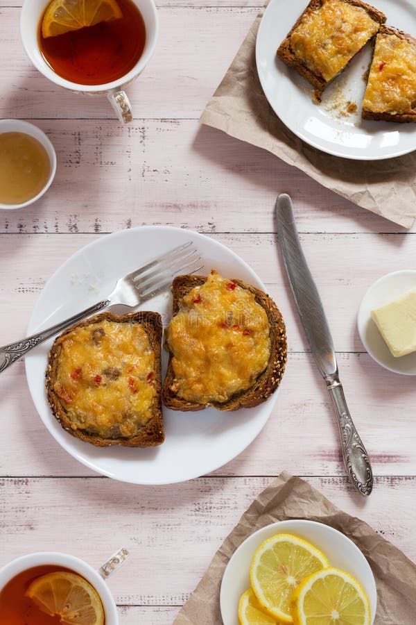 Toasts with Cheese and Lemon Tea Stock Photo - Image of knife, bread ...