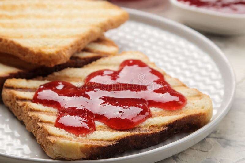 Toasts with Jam. Fried Crispy Toasts with Red Jam on a Light Concrete ...