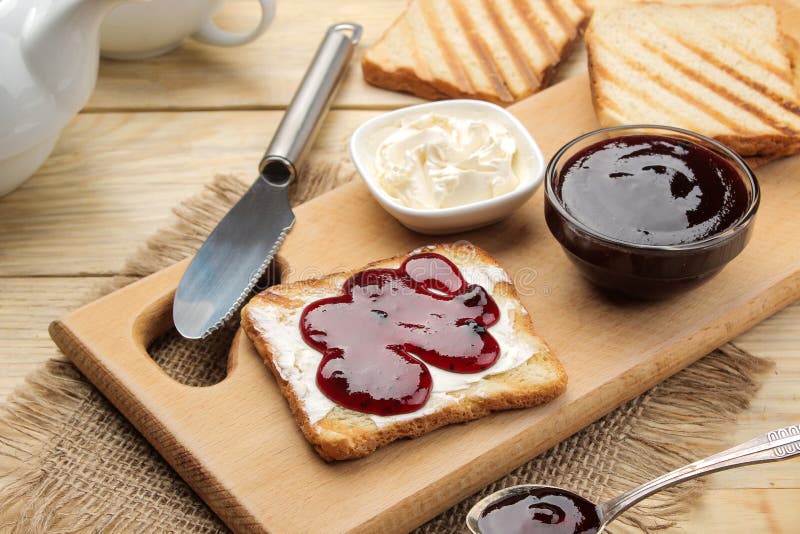 Toasts with Jam. Fried Crispy Toast with Red Jam on a Natural Wooden ...