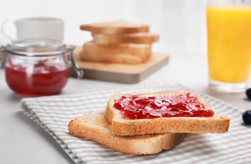 Toasts with jam on table stock photo. Image of dessert - 115681328