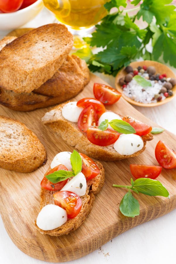 Toasts with Mozzarella, Basil and Cherry Tomatoes, Top View Stock Image ...