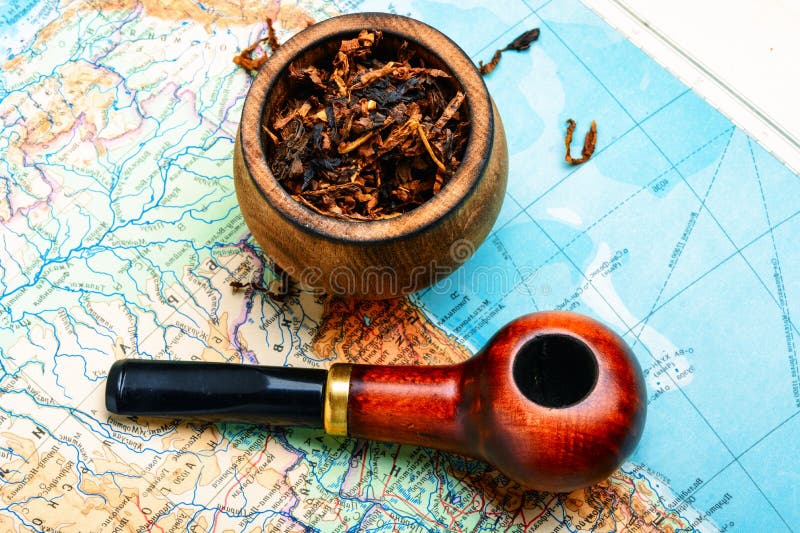 Tobacco pipe on the map stock image. Image of smoking - 144172295