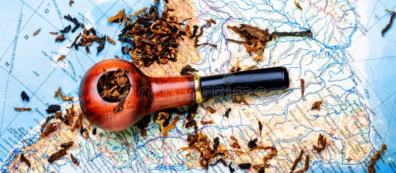 Tobacco pipe on the map stock photo. Image of aromatic - 144172334