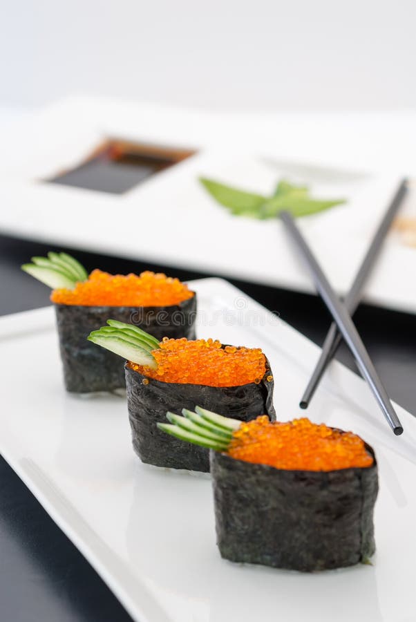 Gunkan-sushi in Nori with Salmon and Tobiko, Close-up, White Background ...