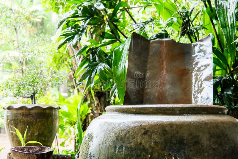 Today is Raining and the Water is Dropping Inside the Old Jar Stock ...