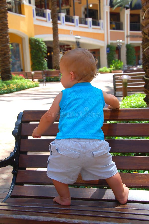 Toddler on bench stock image. Image of outside, child - 1128429