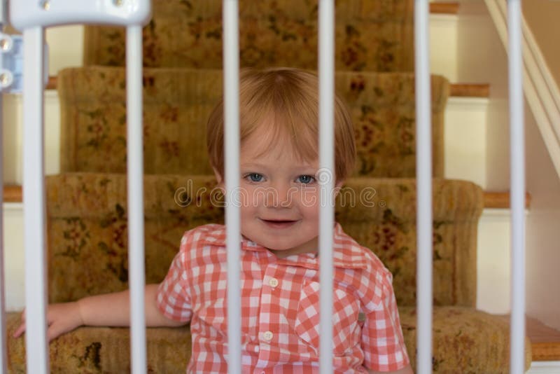 Toddler Boy Behind Baby Gates Stock Photo - Image of home, cute: 71633656