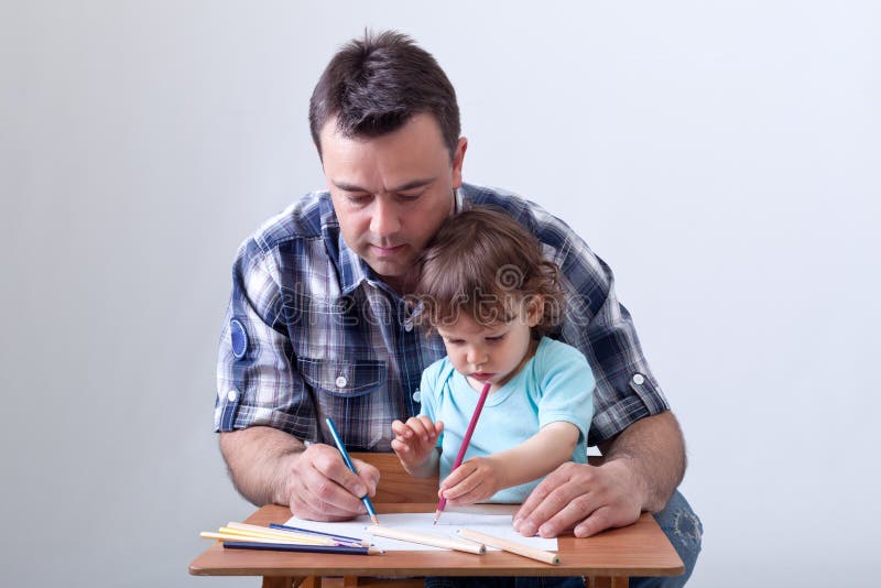 Toddler Boy Drawing with His Father Stock Photo - Image of pencil, love ...
