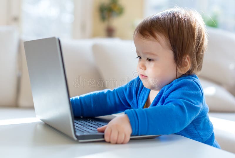 Toddler boy with a laptop stock photo. Image of person - 132656274
