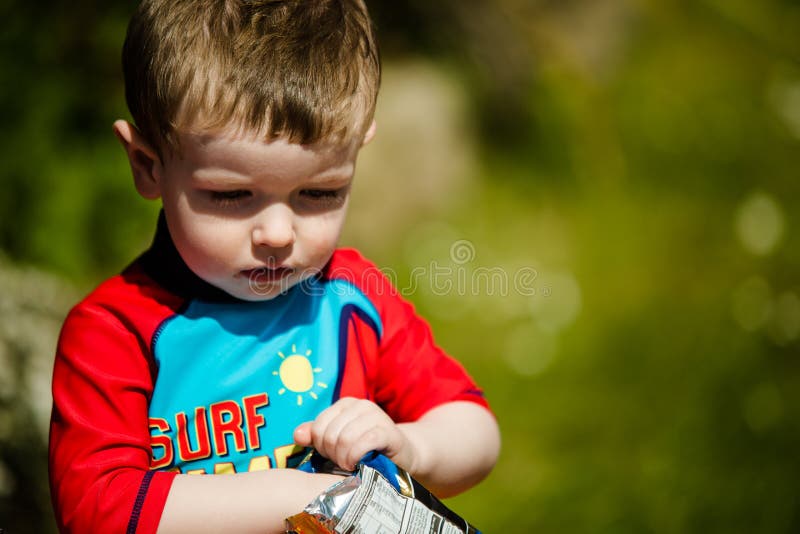 Toddler boy out in sun stock photo. Image of blurred - 92046100