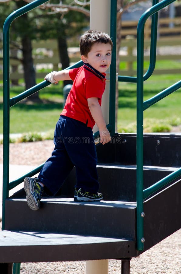 Toddler Boy on Playground Steps Stock Photo - Image of darkhaired, male ...
