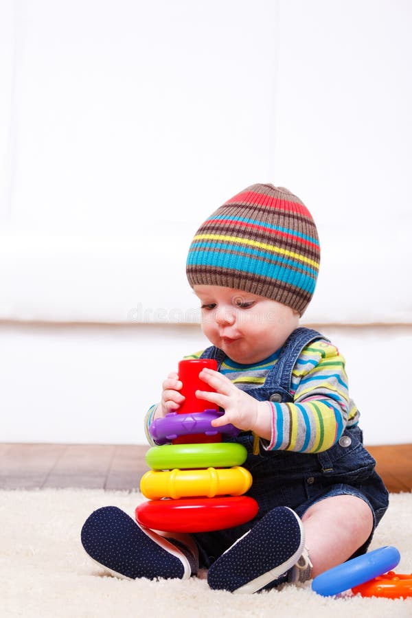Toddler boy playing stock image. Image of green, pyramid - 19153383