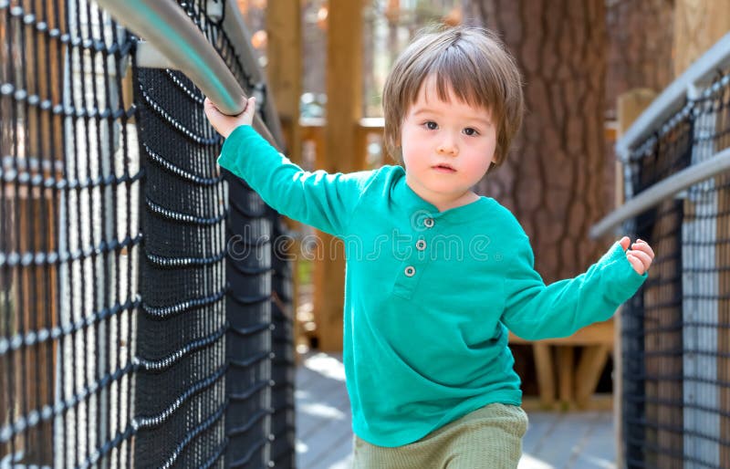 Toddler Boy Playing at a Playground Stock Photo - Image of little ...