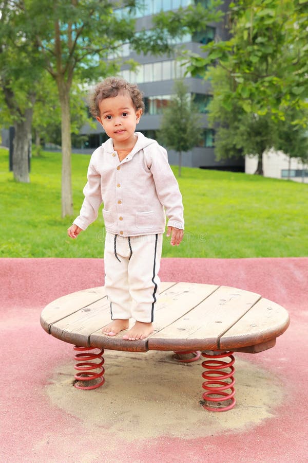 Toddler Boy Playing on Playground - Standing on Spring Platform Stock ...