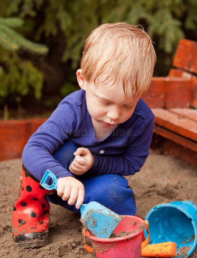 Toddler Boy Playing in Sand Stock Photo - Image of toddler, shovel ...