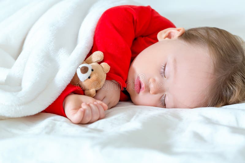 Toddler boy sleeping stock image. Image of stuffed, toys - 130879241