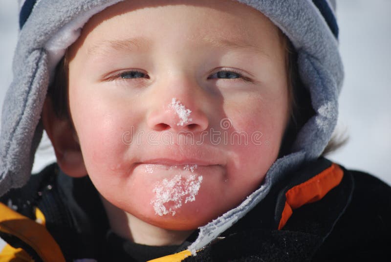 Toddler Boy with Snow on Face Stock Photo - Image of mouth, coat: 12920426