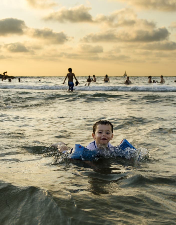 Toddler Boy Swimming in the Ocean Stock Image - Image of kids, suit ...