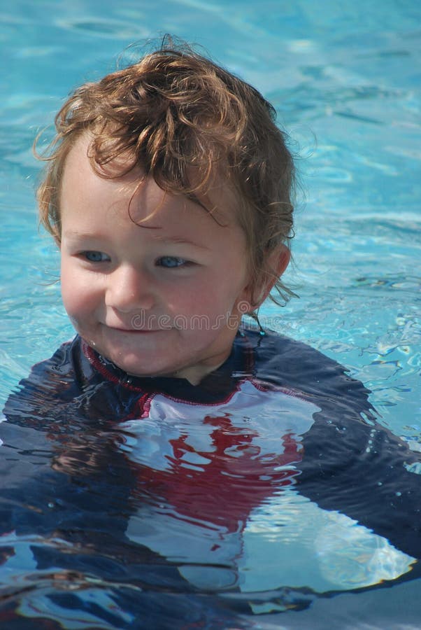 Toddler Boy Swimming in Pool Stock Image - Image of smile, blue: 12385597