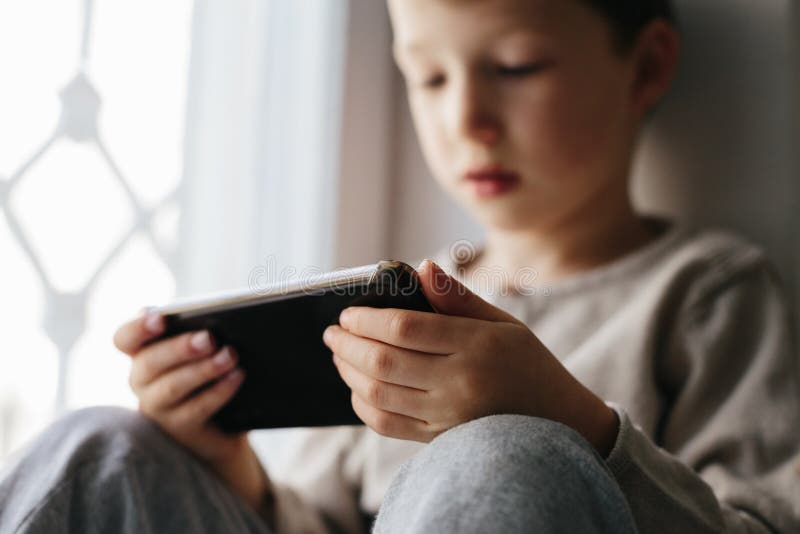 Toddler Boy Using Tablet or Smartphone. Cute Five Years Old Boy Sitting ...