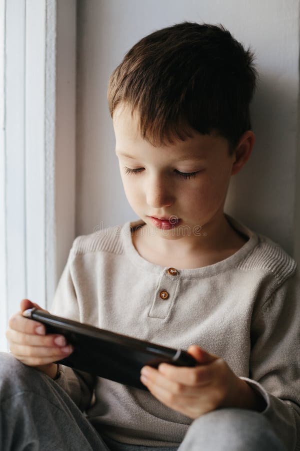 Toddler Boy Using Tablet or Smartphone. Cute Five Years Old Boy Sitting ...