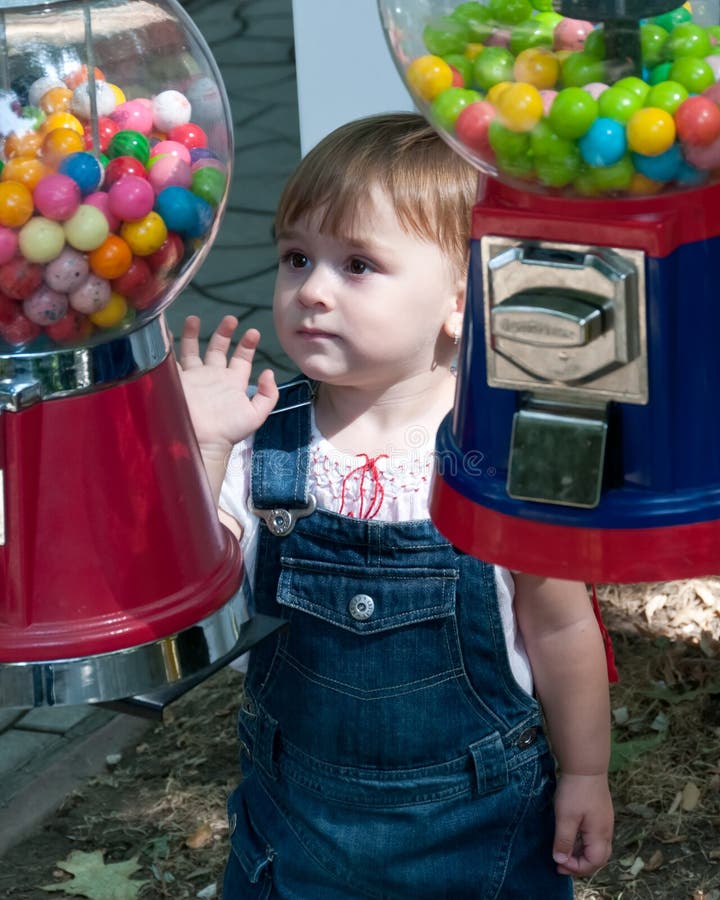 Toddler between candy bins stock photo. Image of depth - 18889478