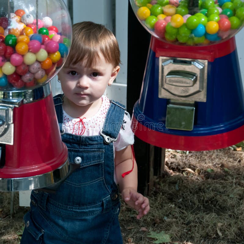 Toddler between candy bins stock image. Image of beauty - 19076127