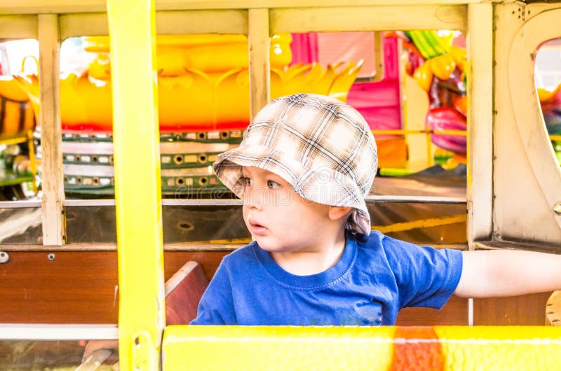Toddler on a carousel stock image. Image of playful, carouseln - 45995705