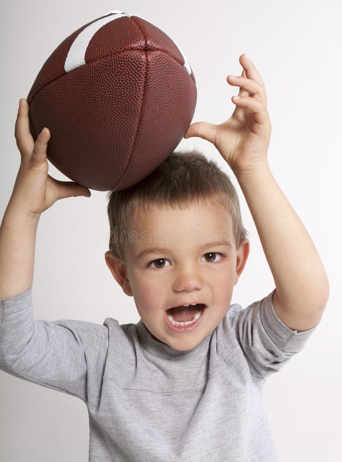 Toddler Catching Football stock photo. Image of happy - 14916900