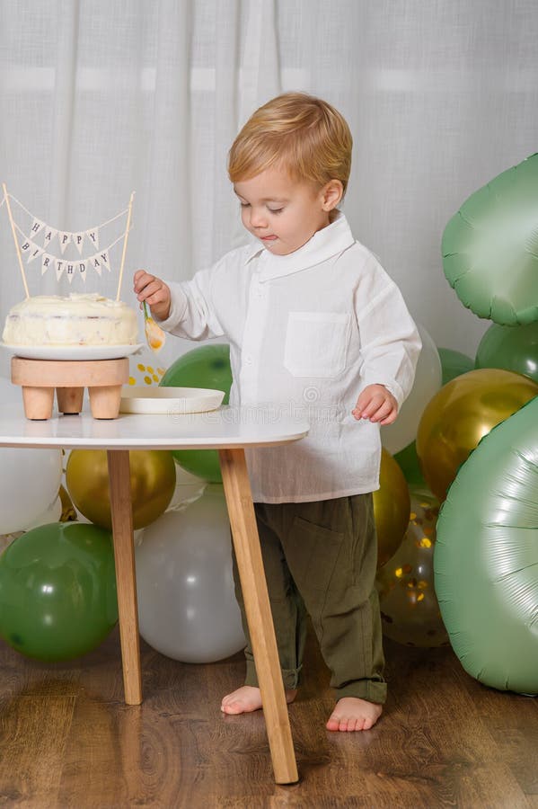 Toddler Celebrating Second Birthday with Cake and Balloons Stock Photo ...