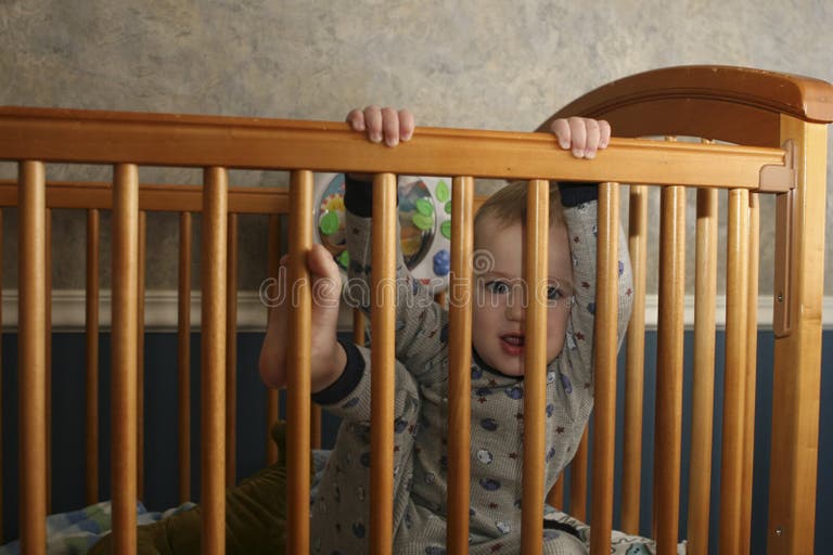 Toddler Climbing Out of Crib Stock Image - Image of baby, bars: 5337941