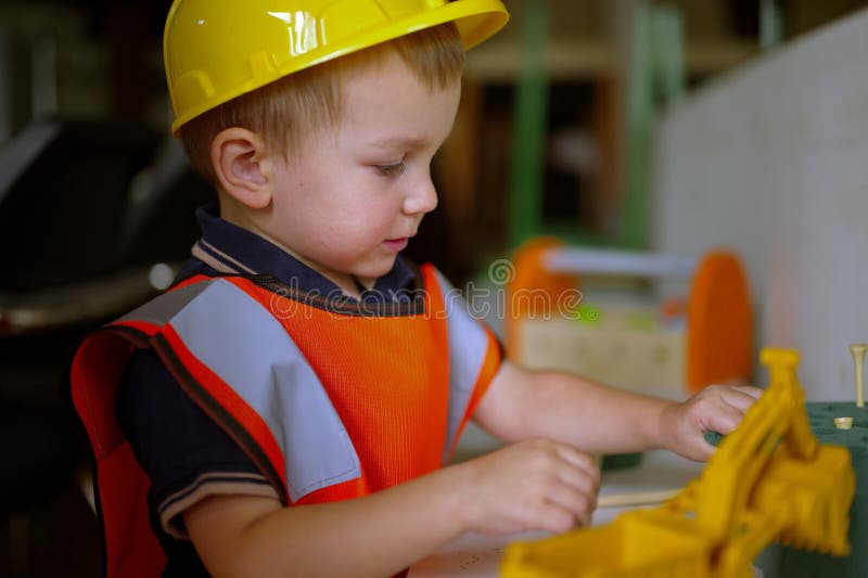 Toddler Dressed As a Builder Playing at Home Stock Photo - Image of ...