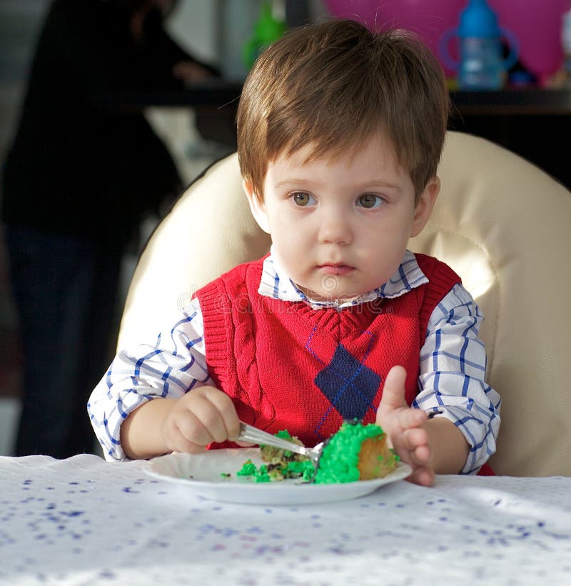 Toddler Eating His Birthday Cake Stock Image - Image of happy, blue ...