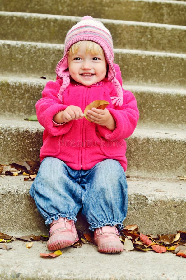 Toddler in fall stock image. Image of fall, holding, baby - 34449889